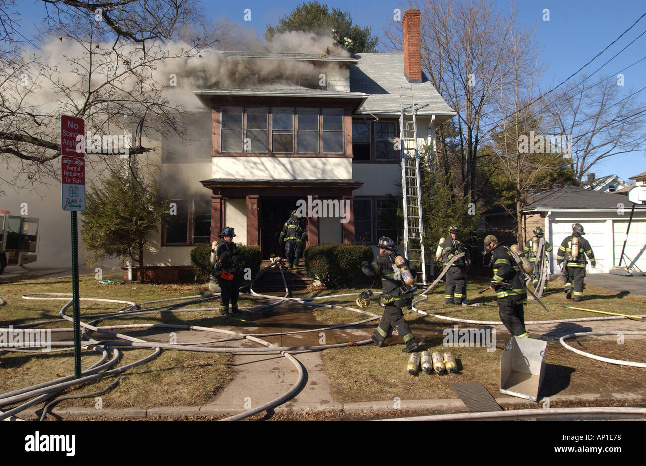 Firefighters fighting a fire House fire Stock Photo - Alamy