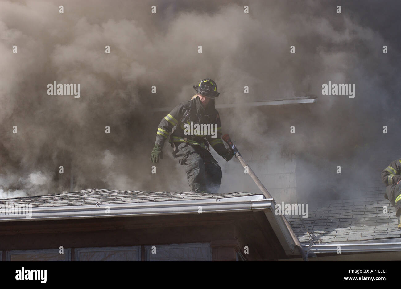 Firefighters fighting a fire House fire Stock Photo - Alamy