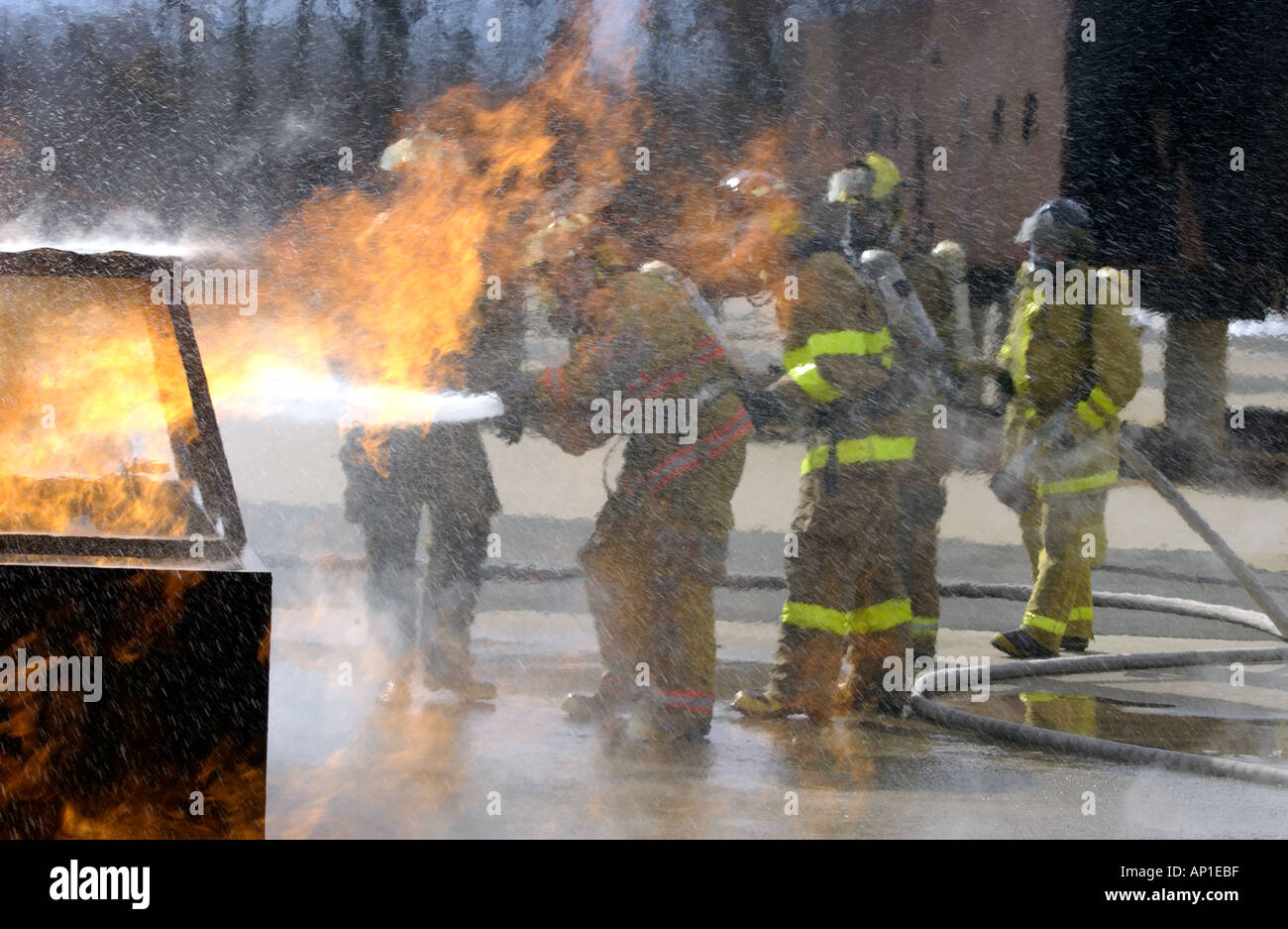 Firefighters training at school with fire Stock Photo - Alamy