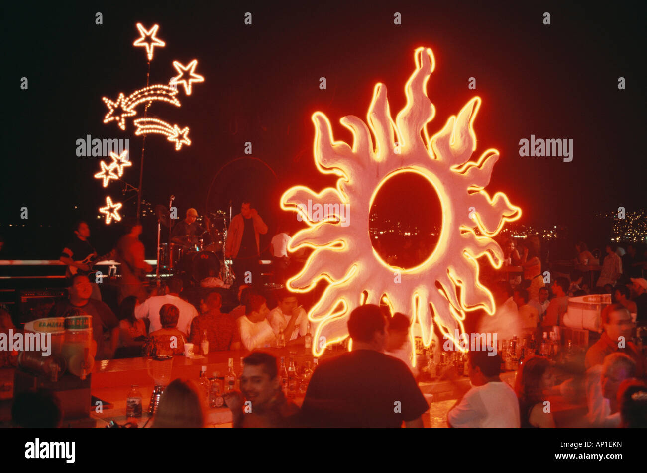 People celebrating in Latino Bar an Playa Icacos, Acapulco, Mexico ...