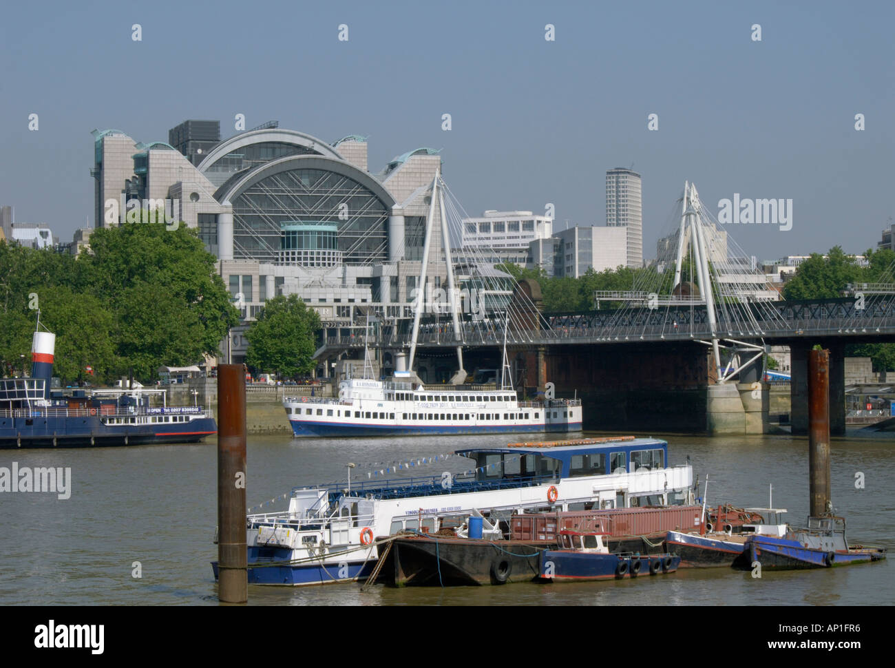 River Thames Golden Jubilee Bridge and Charing Cross Station London UK ...