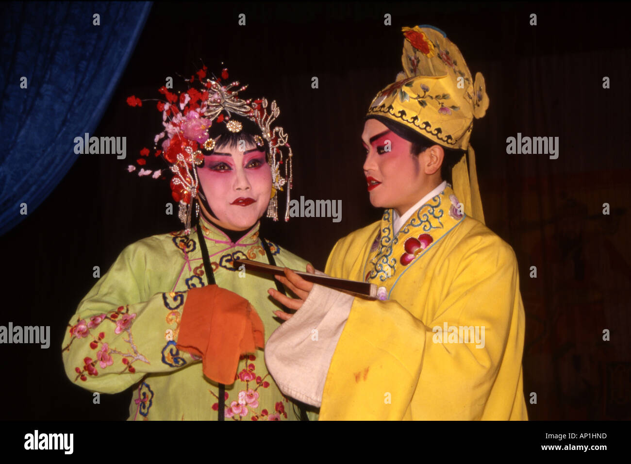bright and colourful dress of a performer acting a scene during a ...