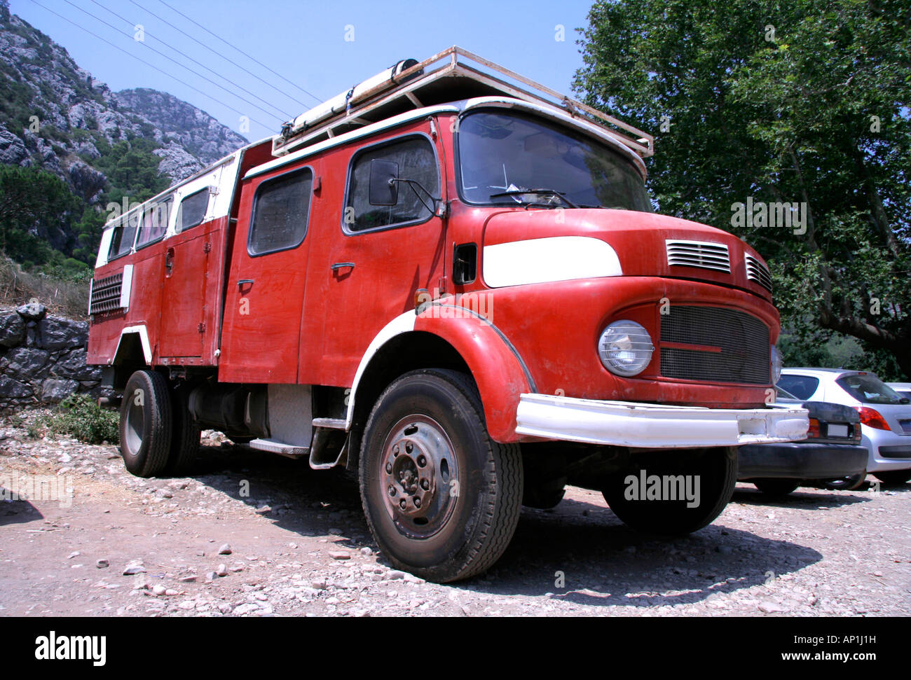 red fire truck converted into a campervan Stock Photo - Alamy