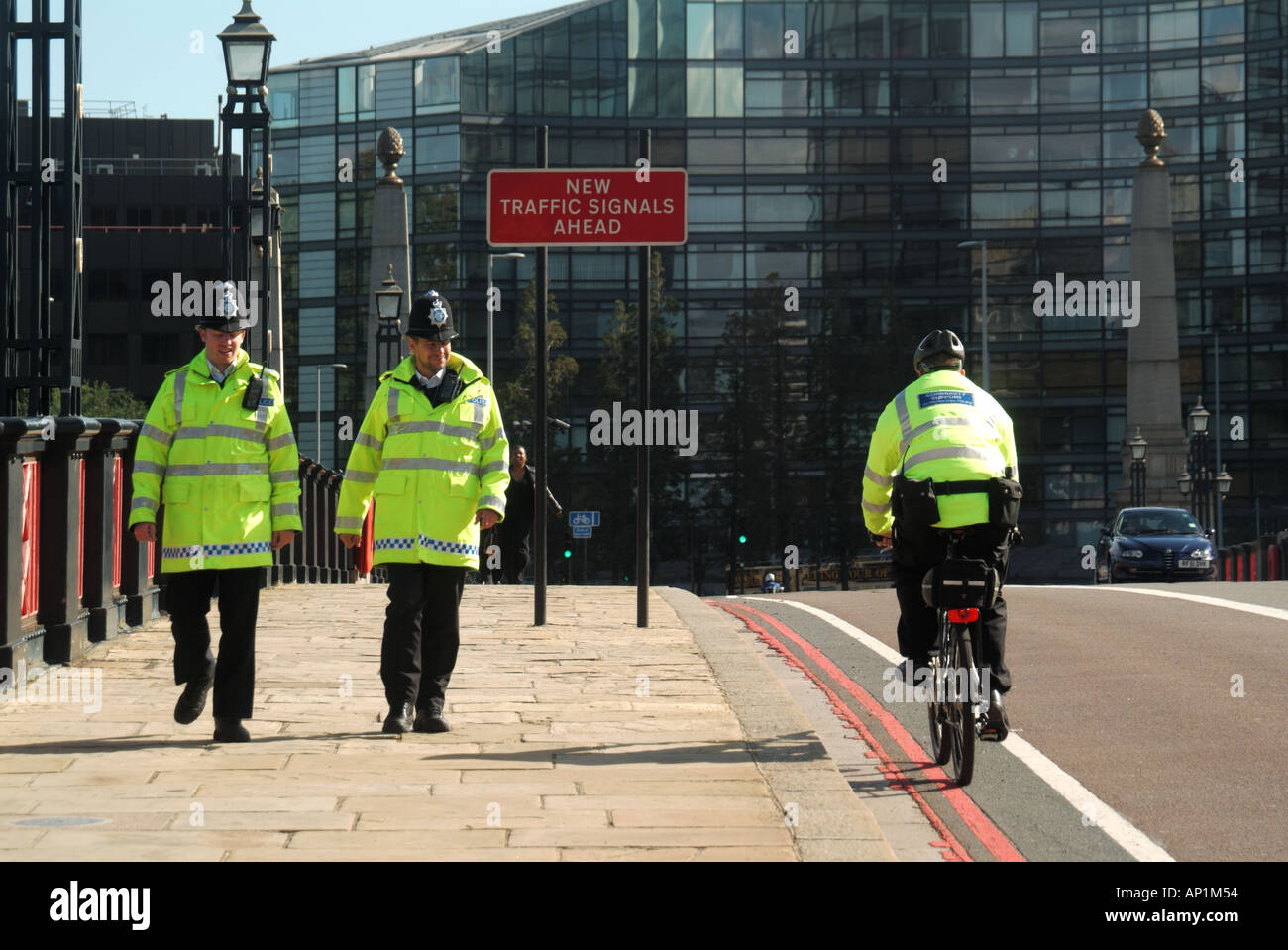 London Lambeth Bridge spanning River Thames 2 two police officers ...
