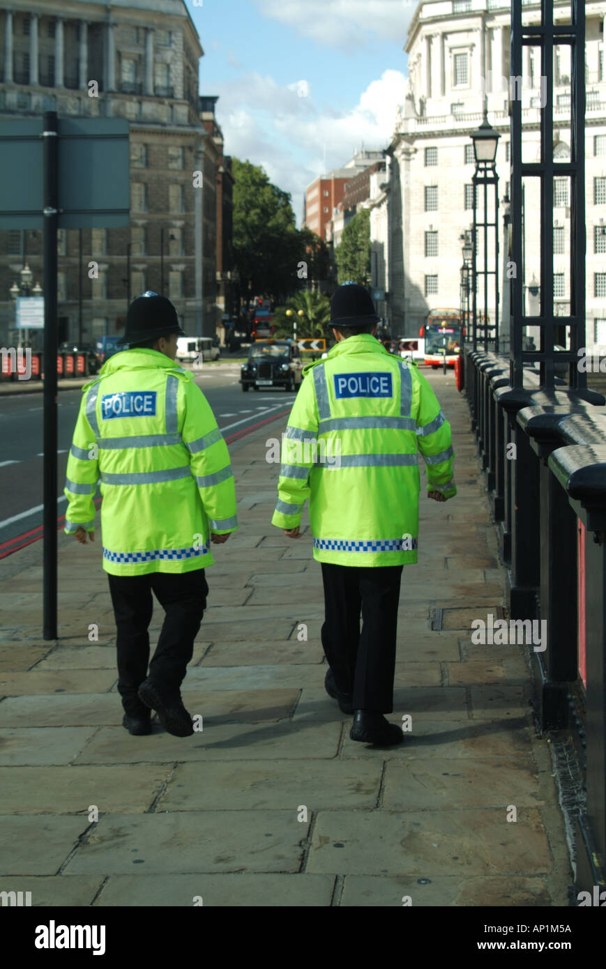 London Lambeth Bridge spanning River Thames 2 two police officers ...