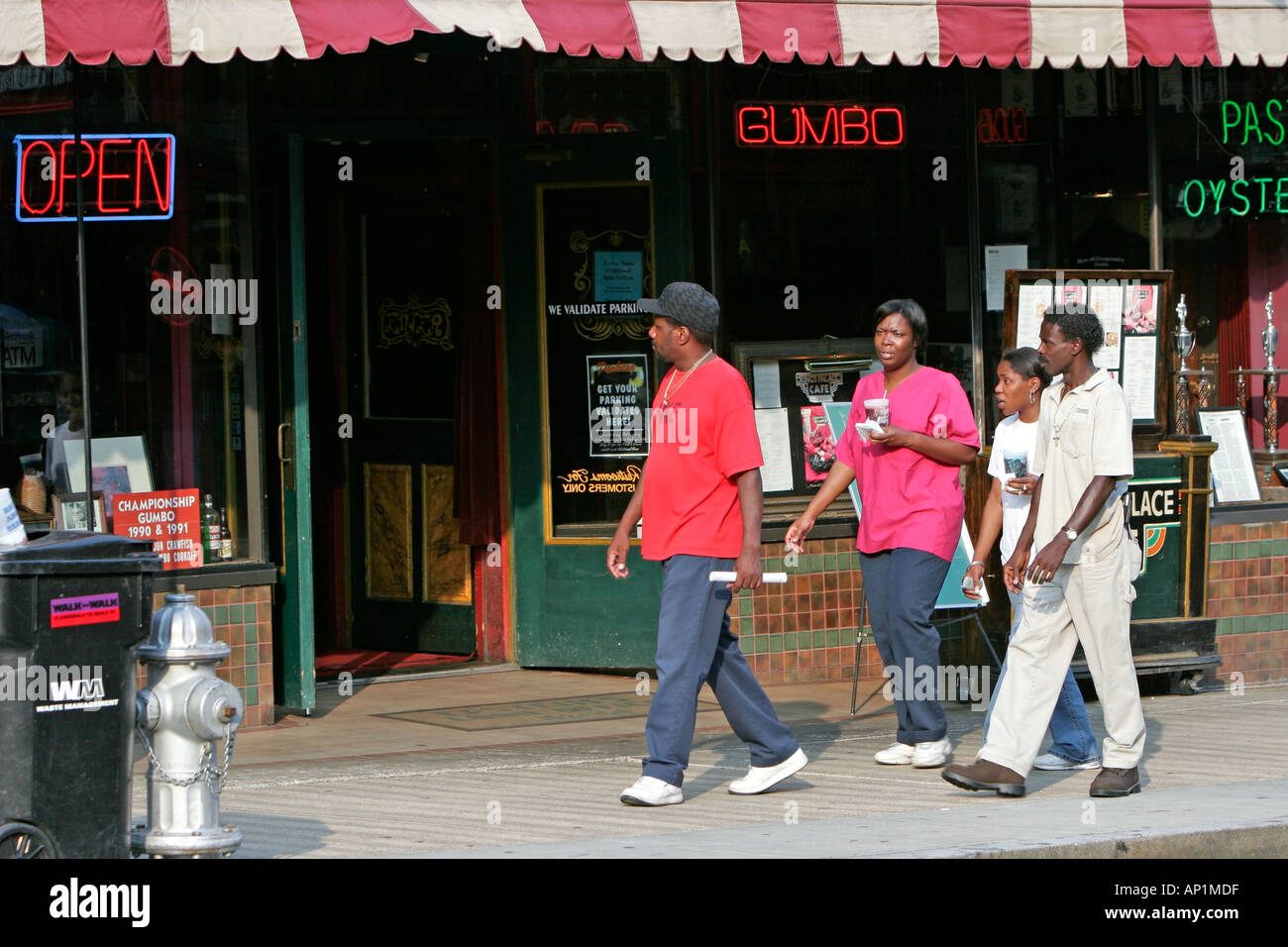 Visitors walking past restaurant and bar Beale Street Memphis USA Stock ...