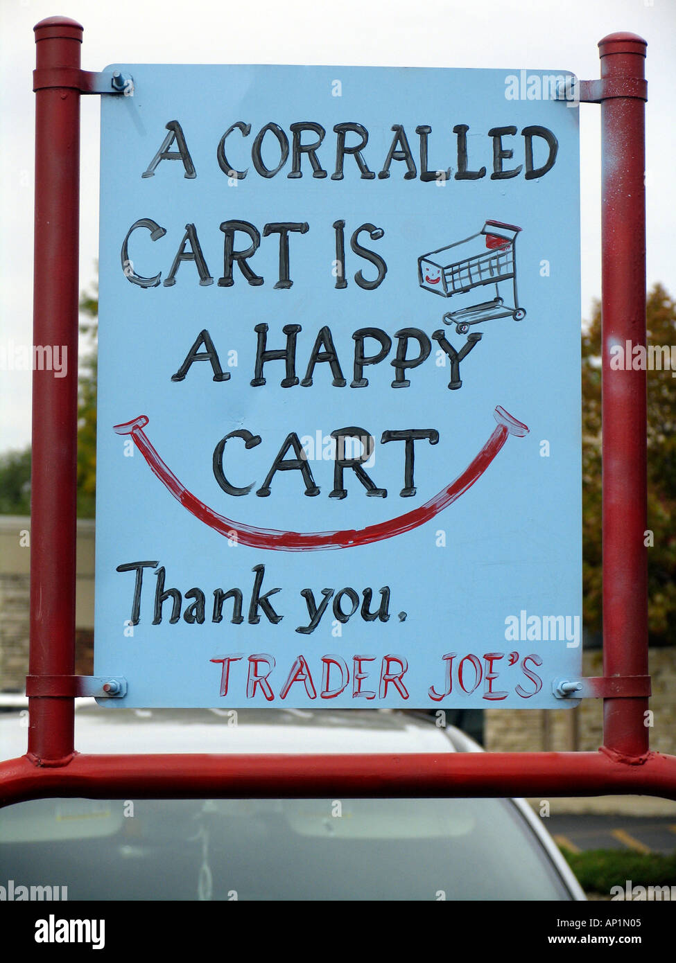 Amusing sign encouraging shoppers to return supermarket trolleys ...