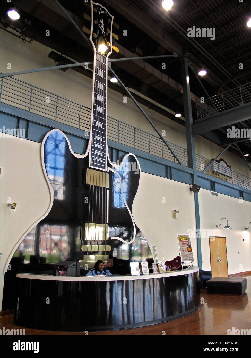 Reception backed by giant guitar motif Gibson Guitars factory and shop ...