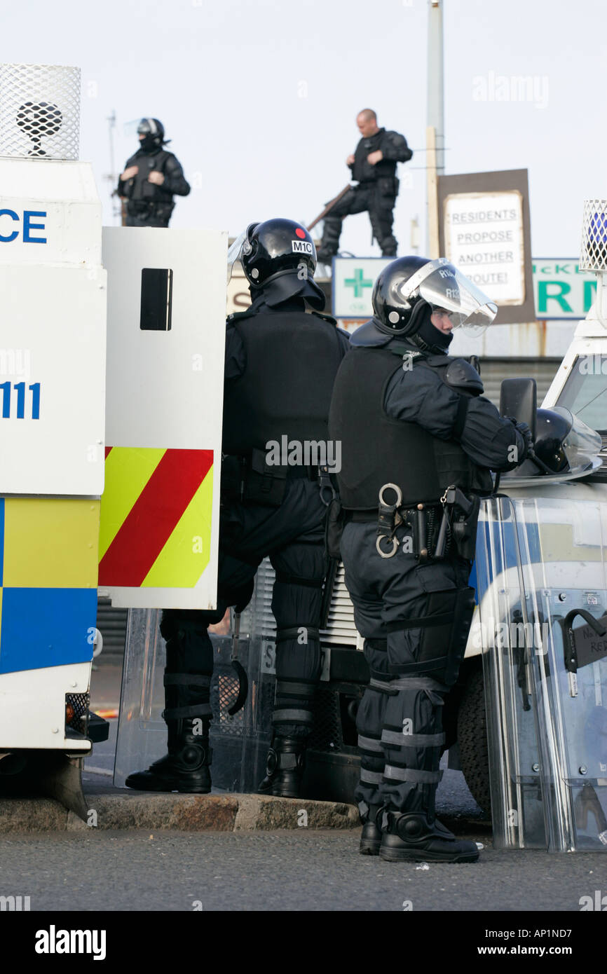 PSNI riot squad officers in protective gear and snipers on crumlin road ...