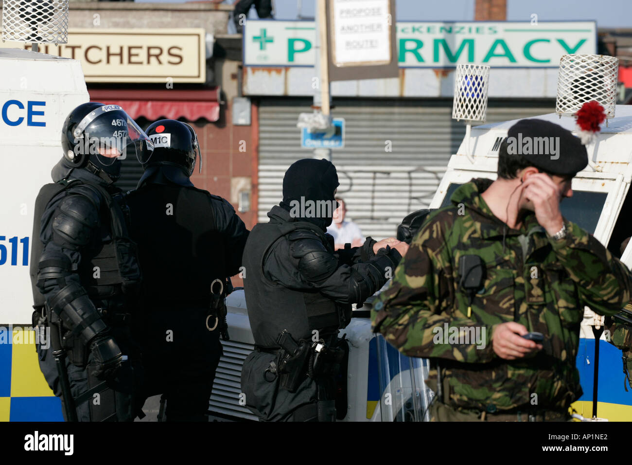PSNI riot officers and British soldier on crumlin road at ardoyne shops ...