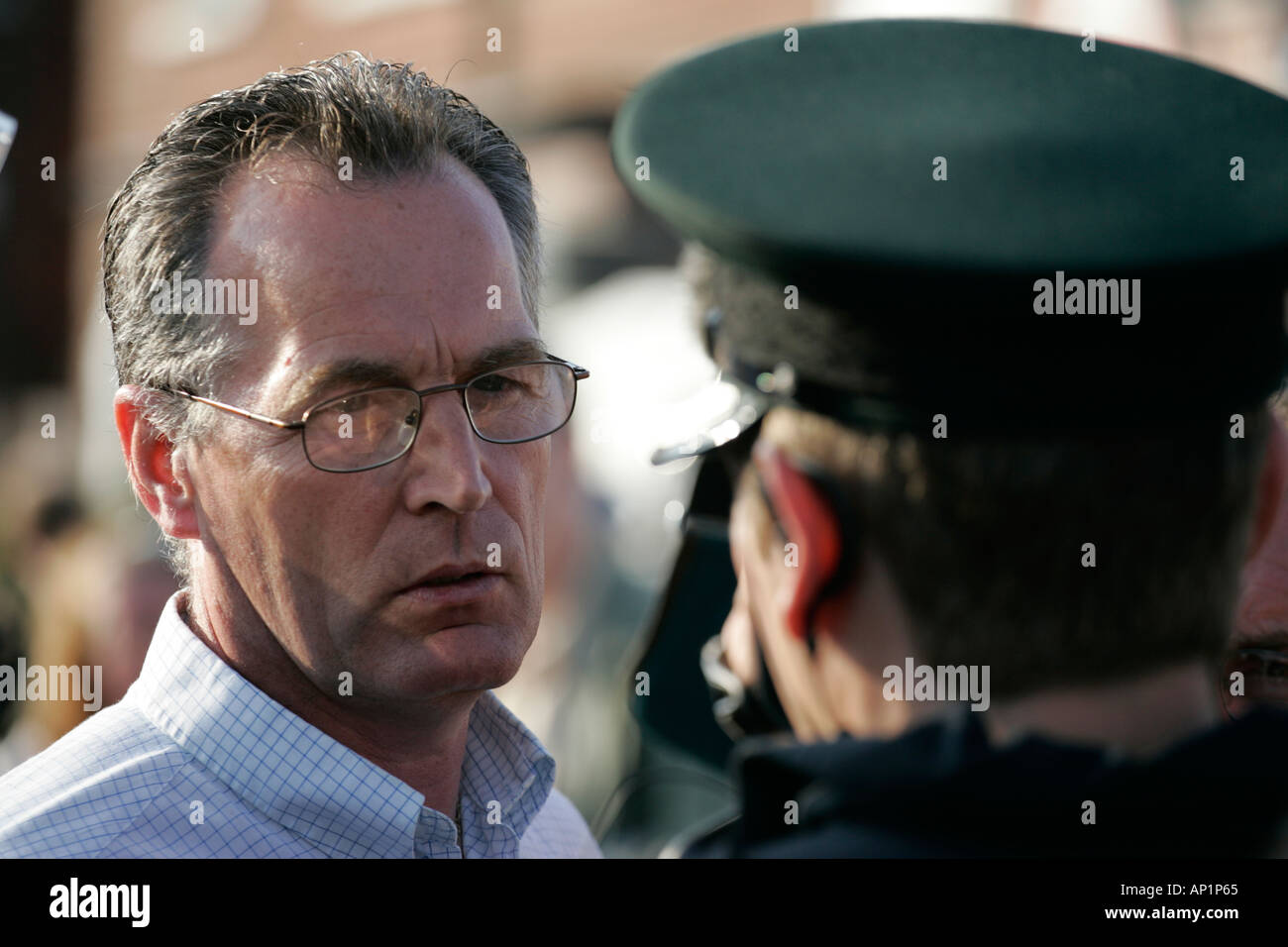 Sinn Fein MLA Gerry Kelly talks to PSNI police officer on crumlin road ...