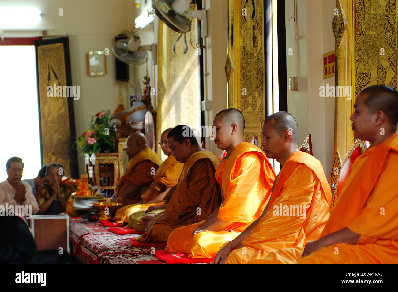 Buddhist monks holding prayers Stock Photo - Alamy