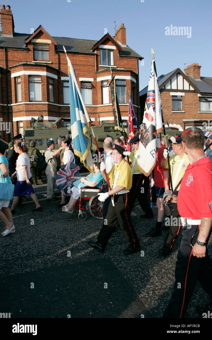 loyalist band with flags marching on crumlin road at ardoyne shops ...
