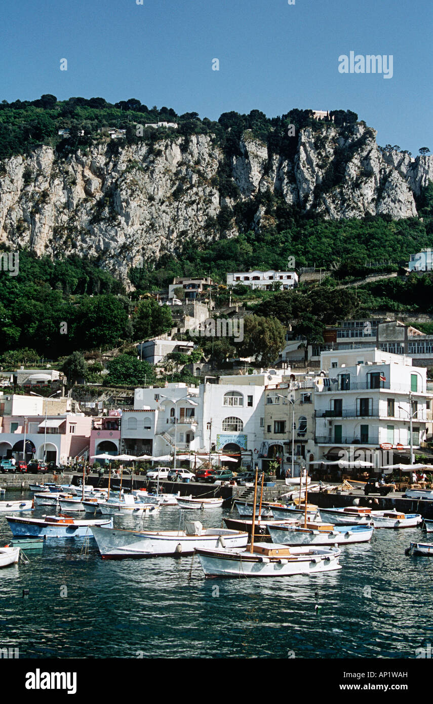 View of harbour, buildings and mountains from the sea, Marina Grande ...