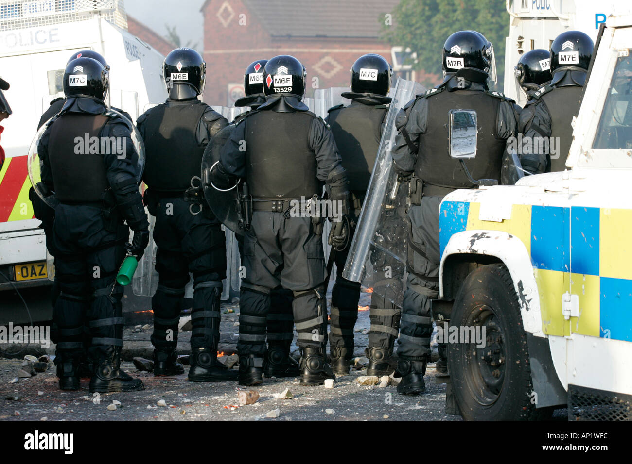 PSNI riot officers watch rioting on crumlin road at ardoyne shops ...