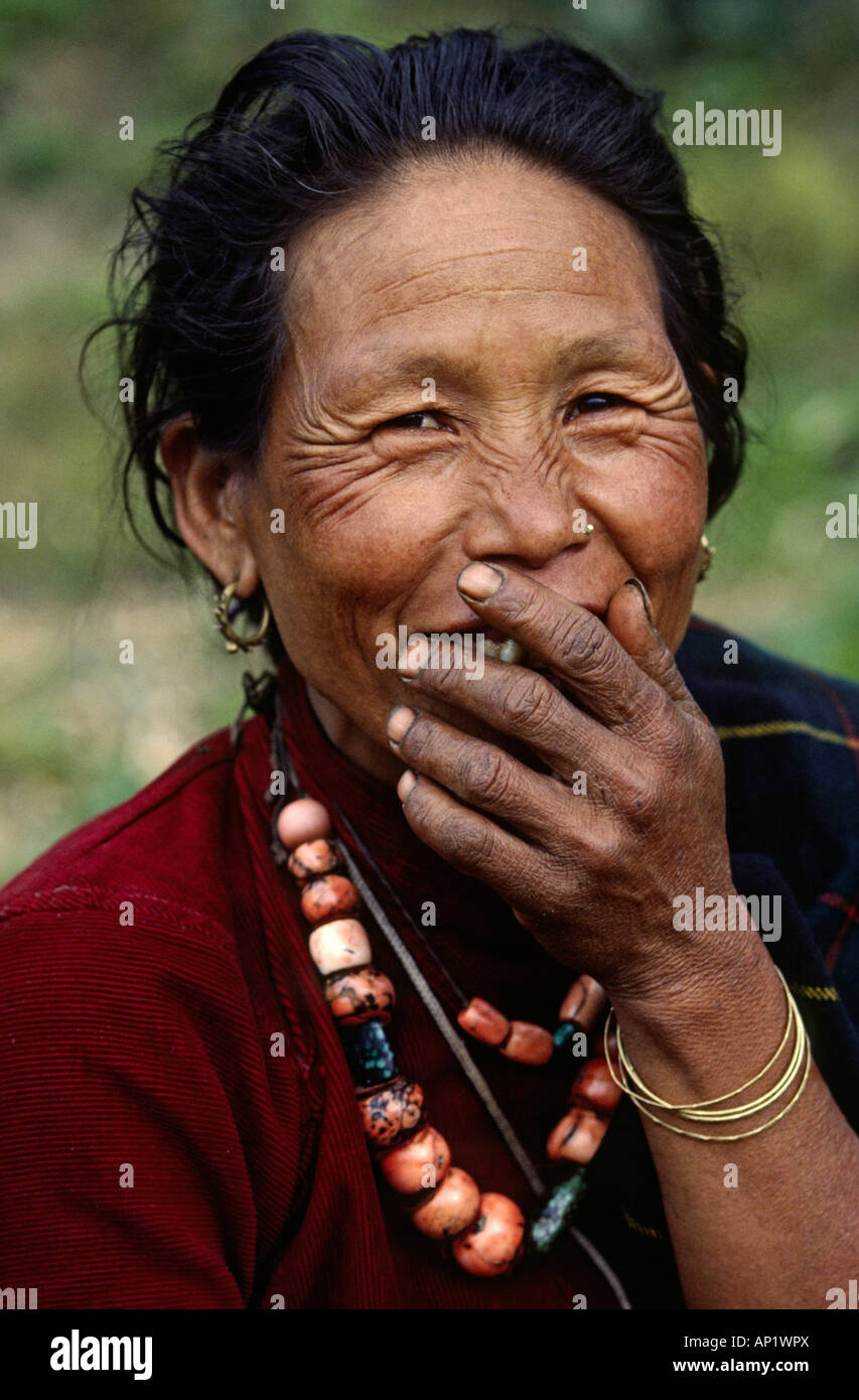 A NEPALI WOMAN of the GURUNG tribe wears a red CORAL NECKLACE ANNAPURNA ...