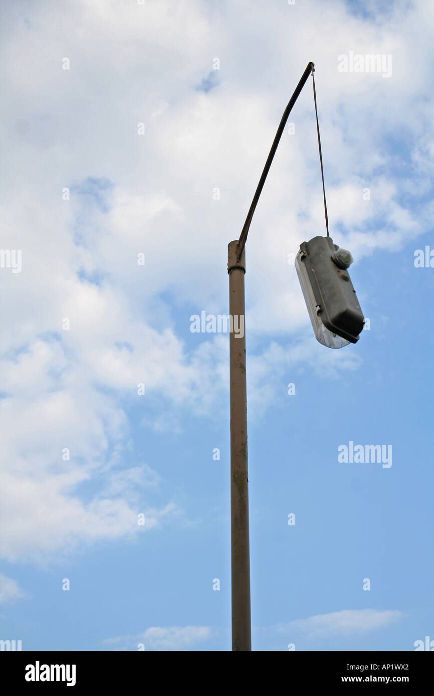 Broken lamppost hanging by thread Stock Photo - Alamy