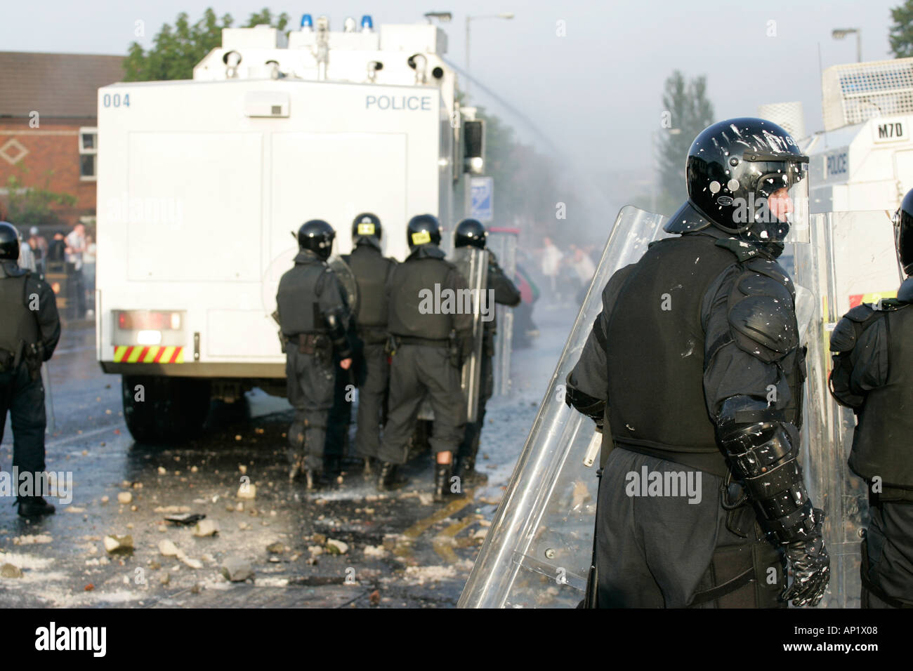 PSNI riot officers behind water canon during rioting on crumlin road at ...