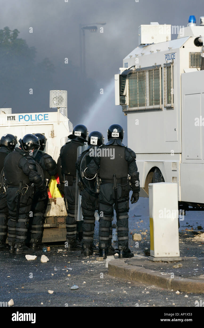 PSNI riot officers behind armoured land rover and water cannon on ...