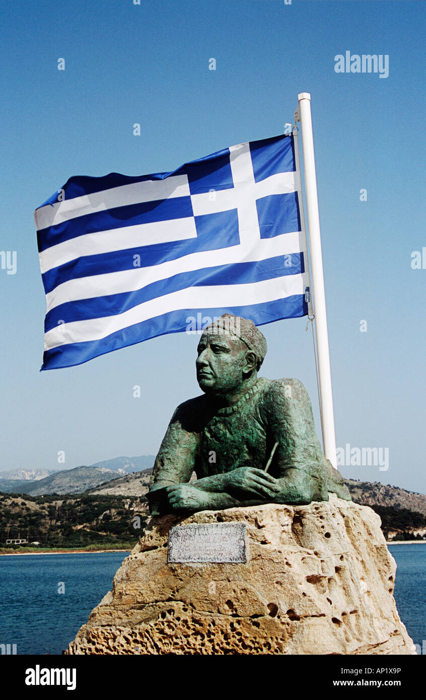 Statue with Greek flag above at entrance to Argostoli Port and Harbour ...