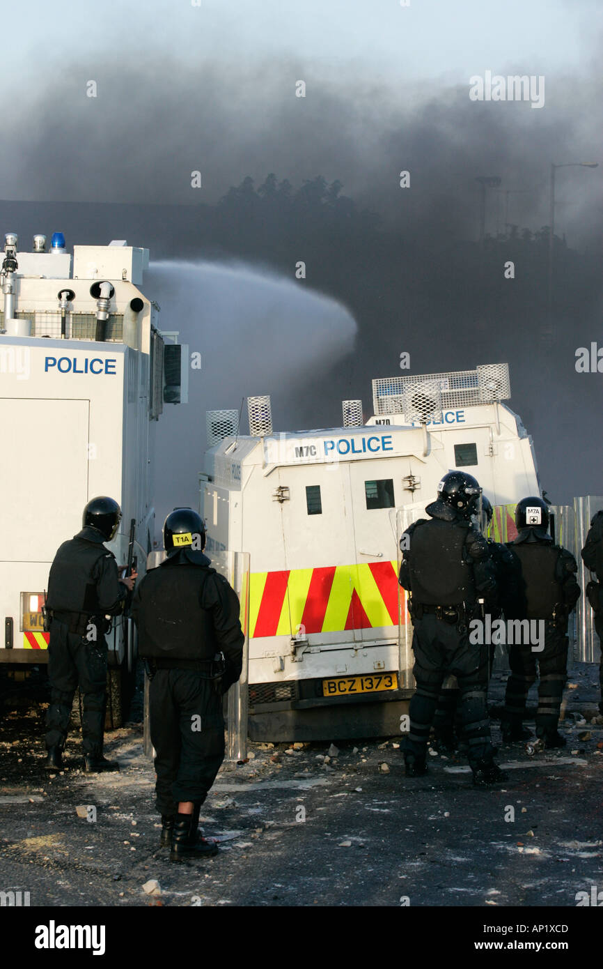 PSNI riot officers behind armoured land rover and water cannon on ...