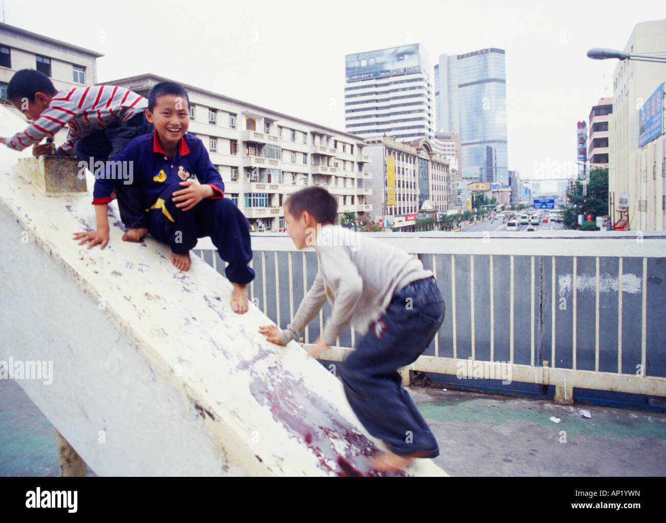 3 Asian Kids Playing On Bridge High Resolution Stock Photography and ...