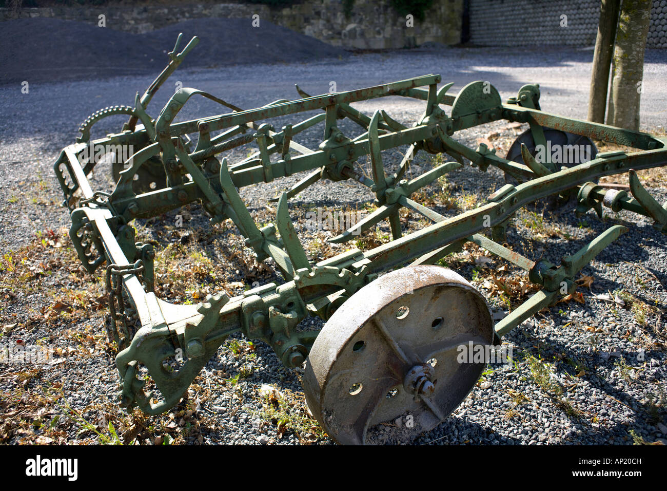 Old fashioned Harrow or Cultivator on gravel path Wiltshire England ...