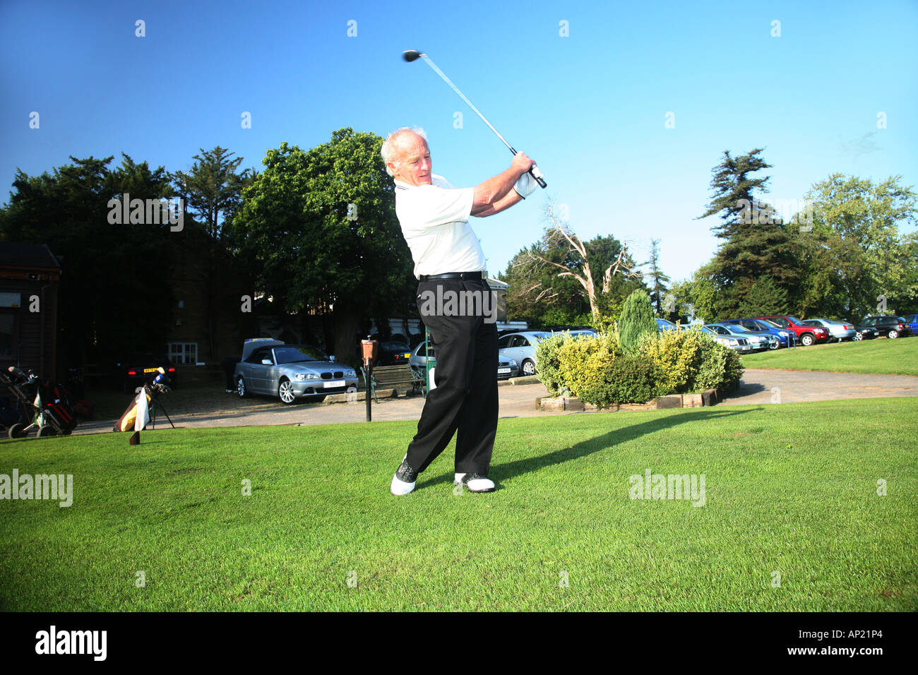 Man teeing off Stock Photo - Alamy