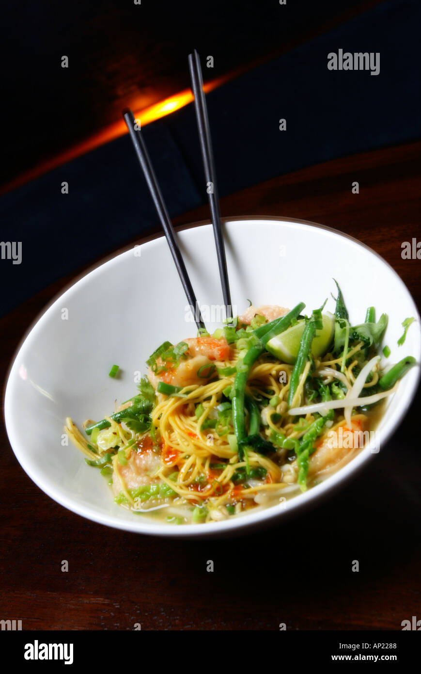 Chinese fish and noodle dish Stock Photo - Alamy