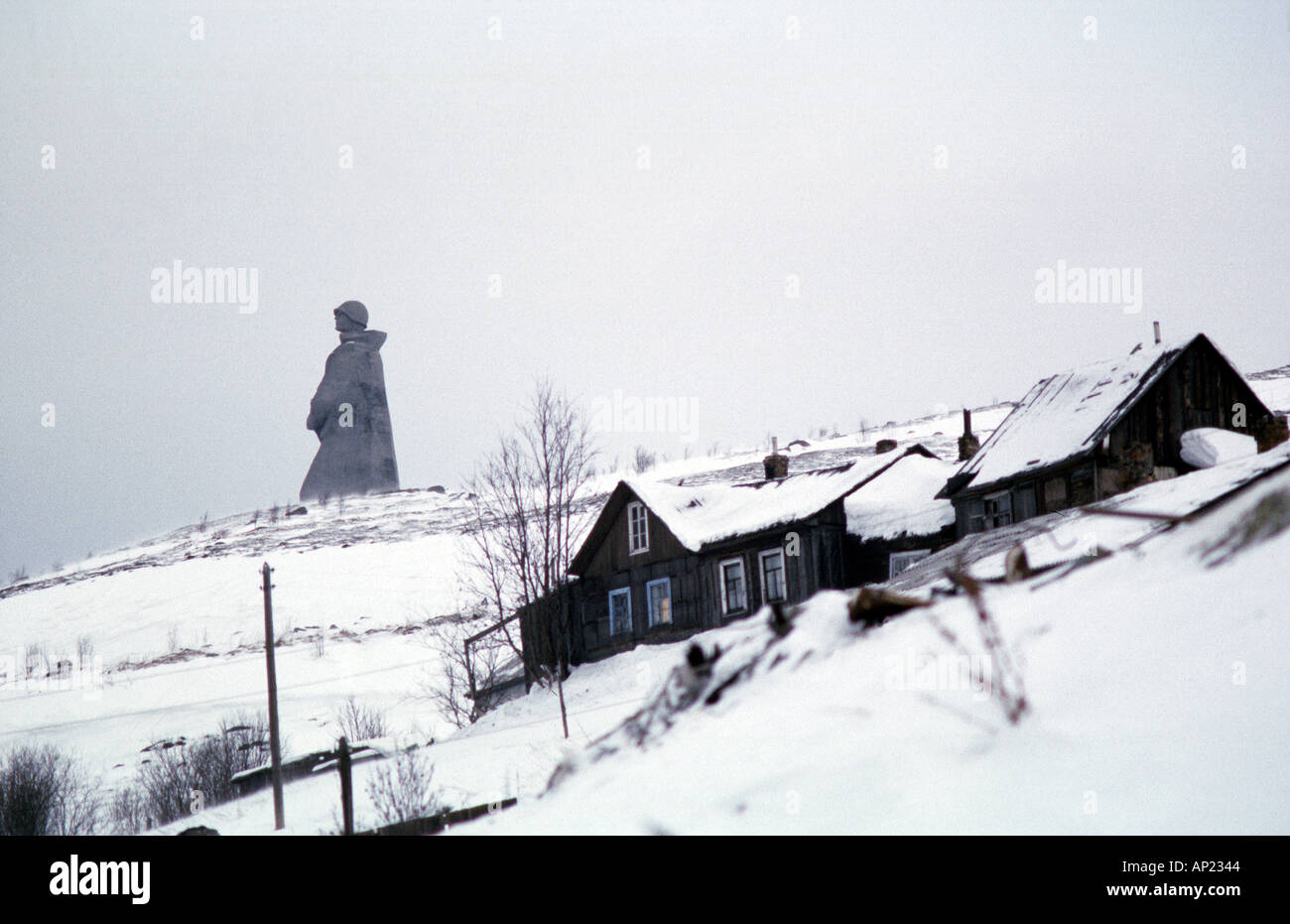 Statue over harbour Murmansk Stock Photo - Alamy