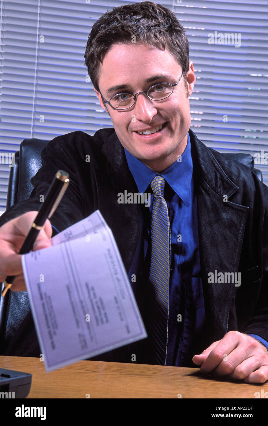 Handing a check hi-res stock photography and images - Alamy