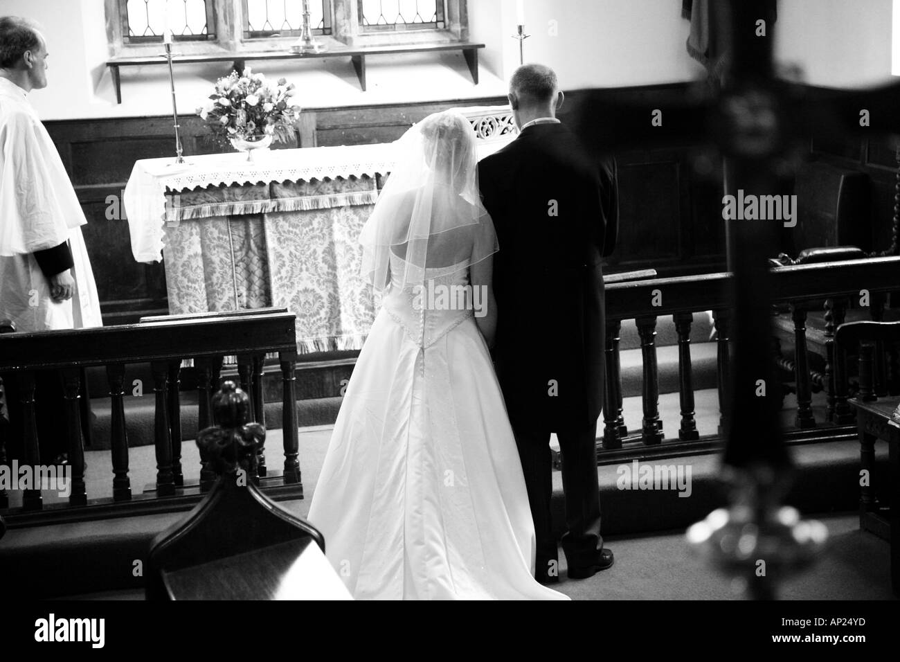 Couple getting married in a church Stock Photo - Alamy