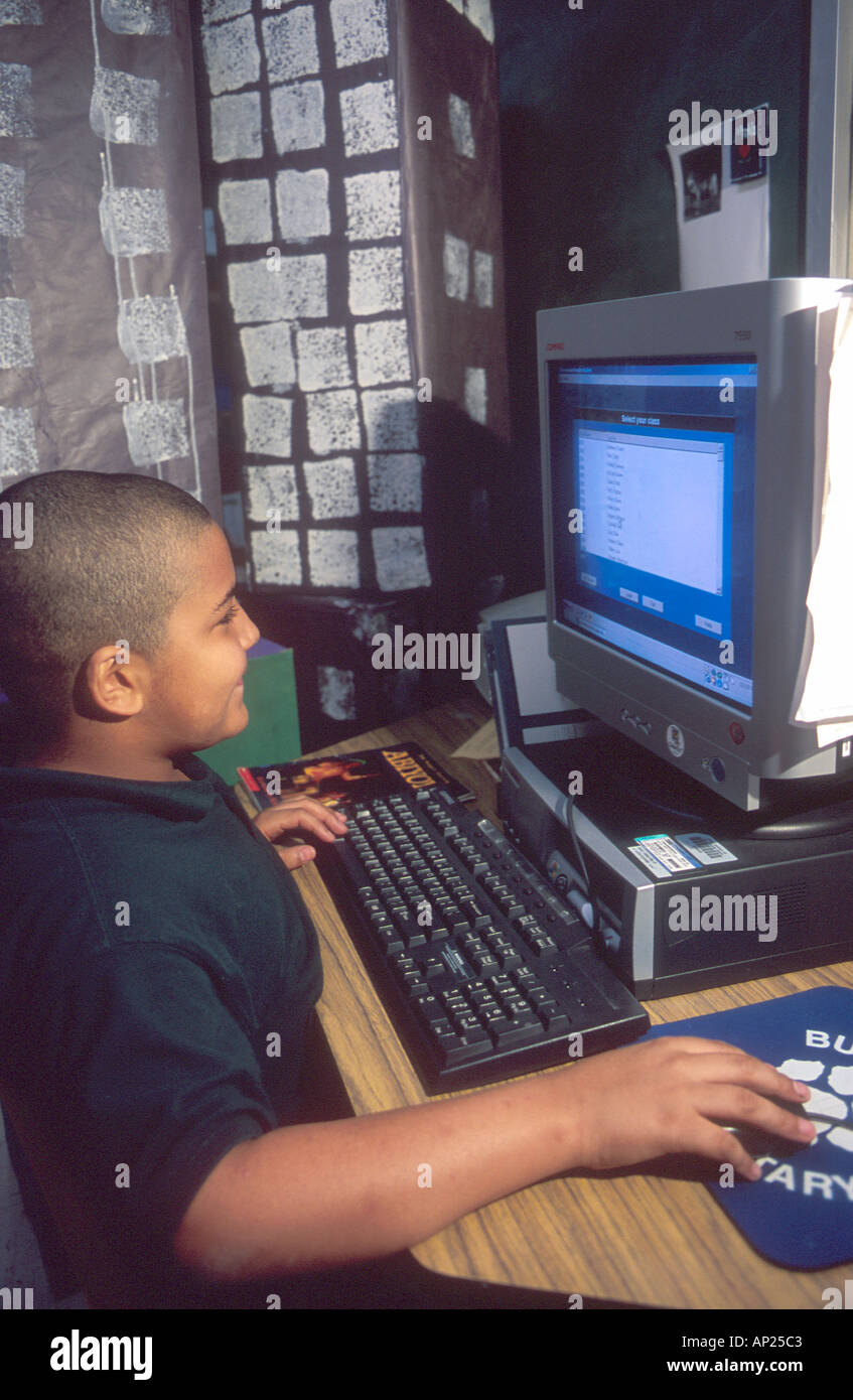 Elementary school student using computer Stock Photo - Alamy