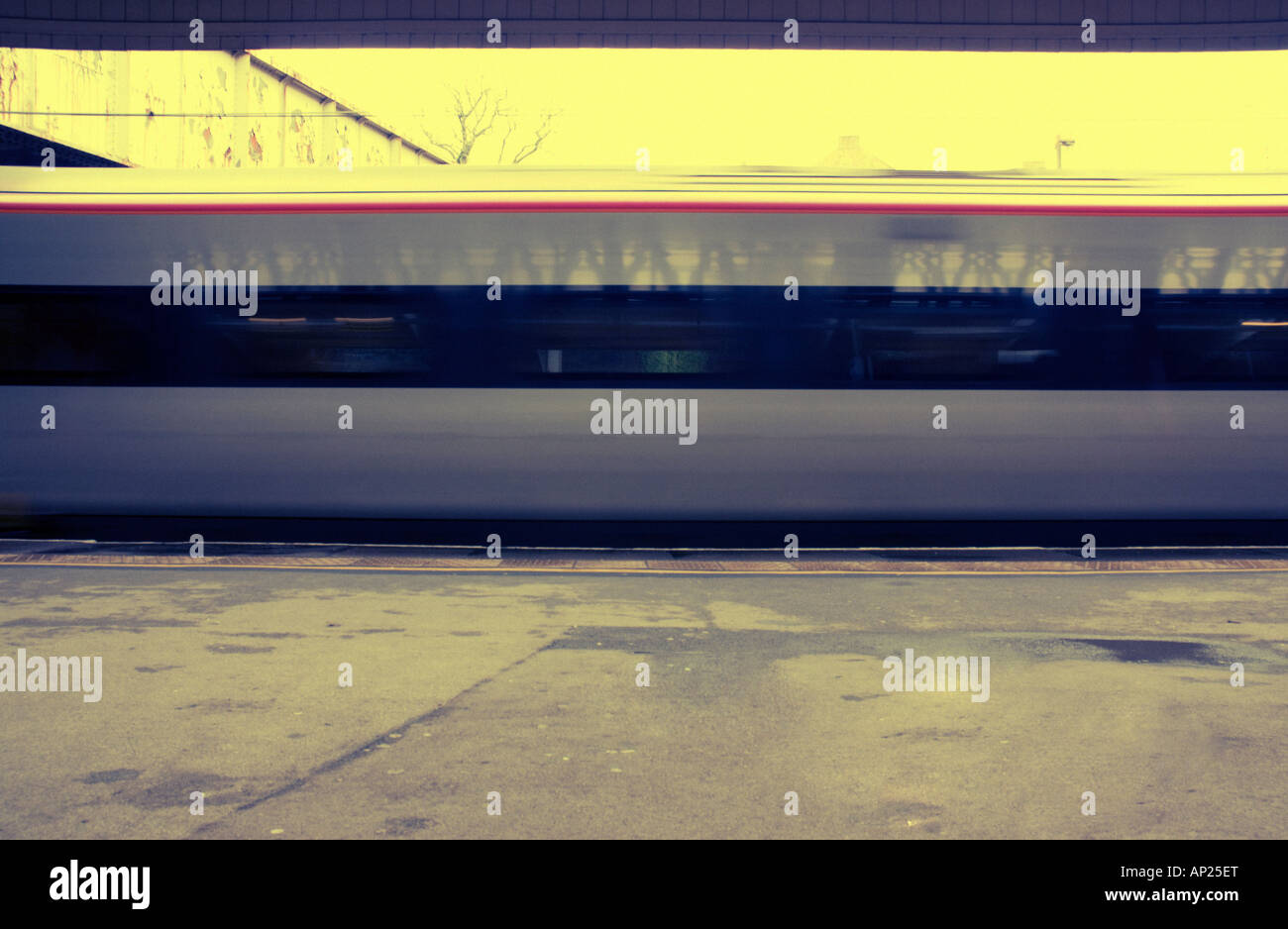 Fast train going through a station Stock Photo - Alamy
