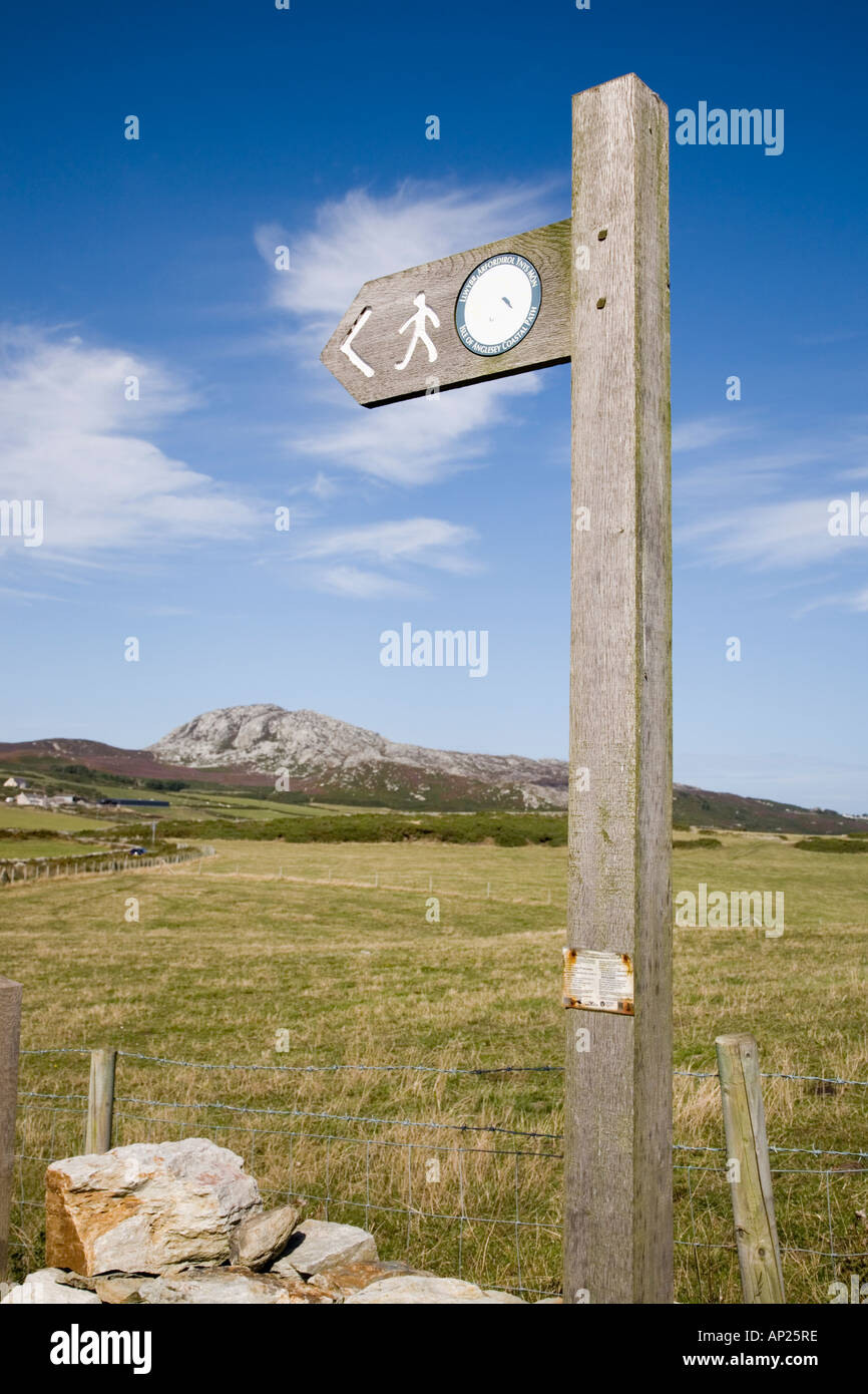 ISLE of ANGLESEY COASTAL PATH SIGN against blue sky with Holyhead ...