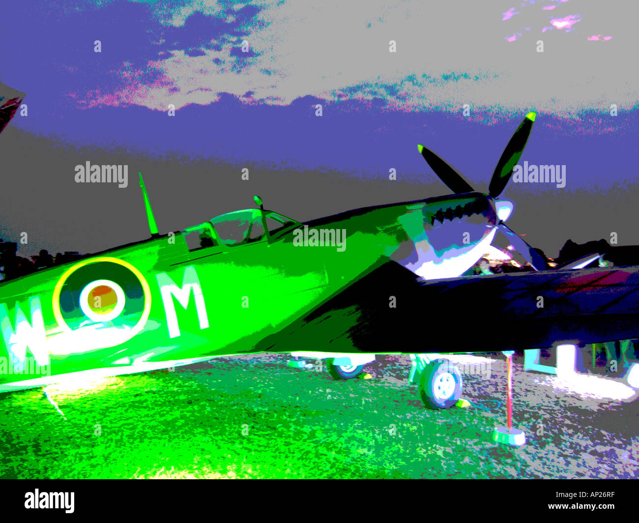 Spitfire floodlit by coloured lights at Duxford airfield ...