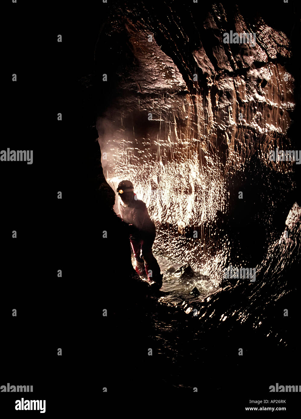 Caver in cave passage Wales, UK Stock Photo - Alamy