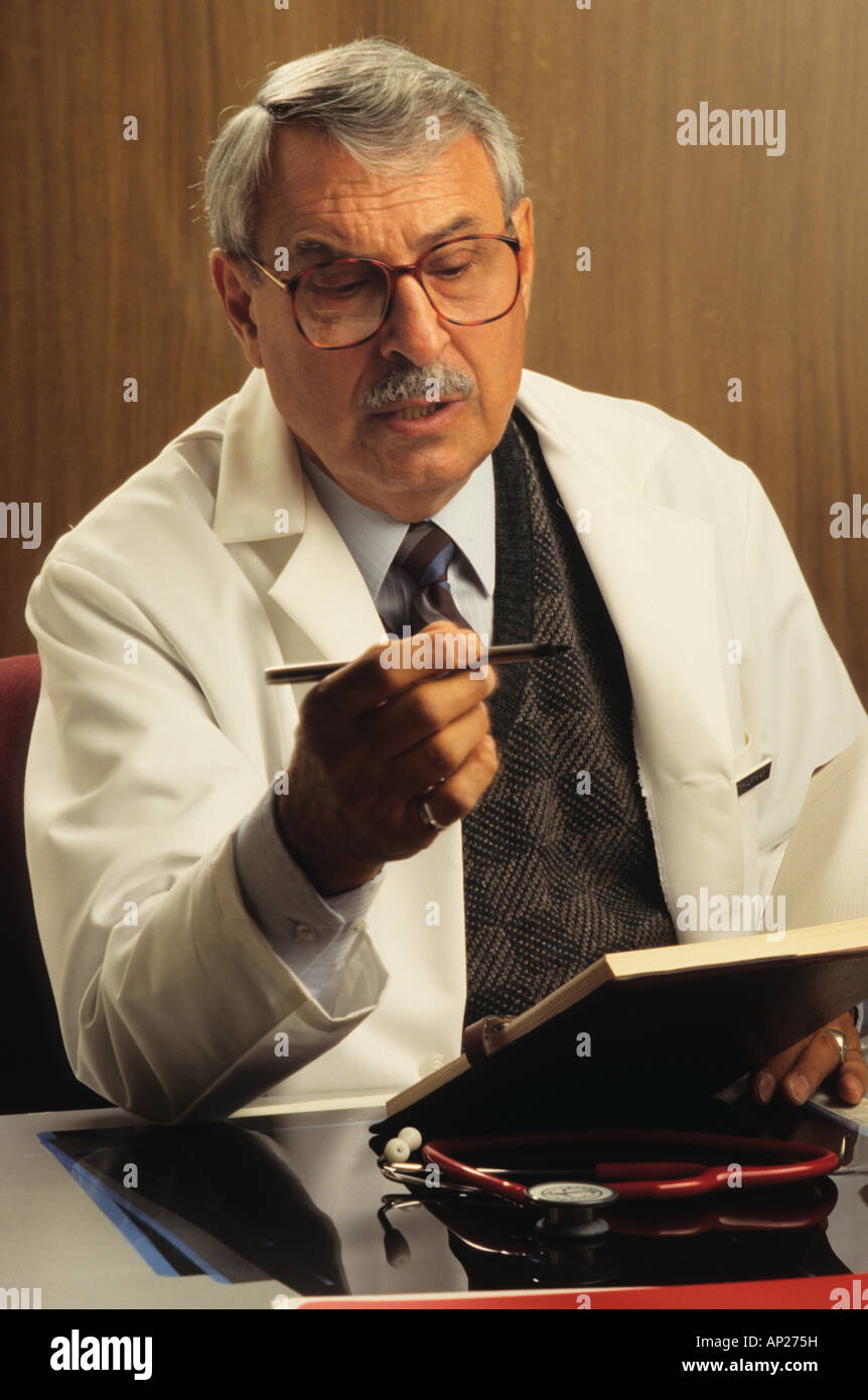Doctor checking medical tests Stock Photo - Alamy