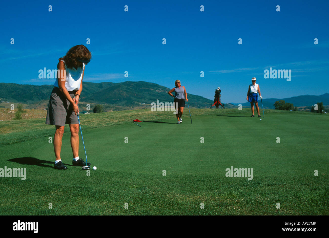 Golfer putting Haymaker golf course Steamboat Springs Colorado USA ...