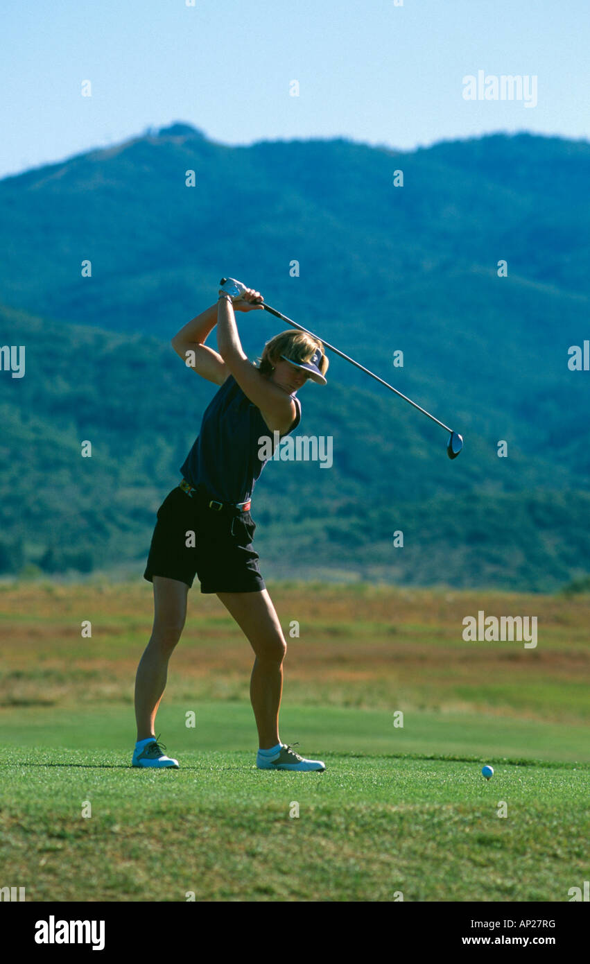 Golfer teeing off Haymaker golf course Steamboat Springs Colorado USA ...