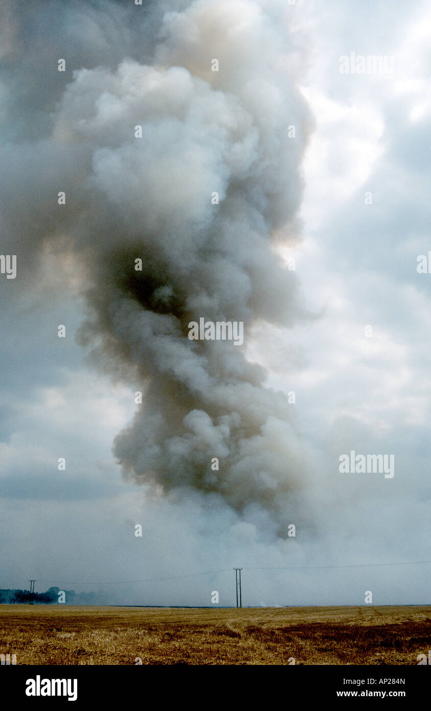 A pall of smoke as a farmer burns off stubble Stock Photo - Alamy
