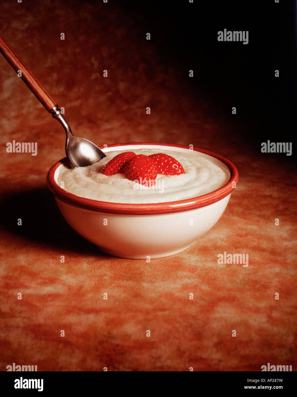 Classic bowl of Strawberry Slice topped Farina cereal with spoon Stock ...
