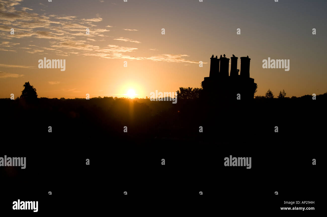 sunrise over rooftop and woodland in kent, england Stock Photo - Alamy
