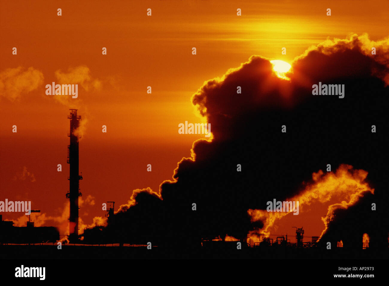 Sunset factory steam Stock Photo - Alamy