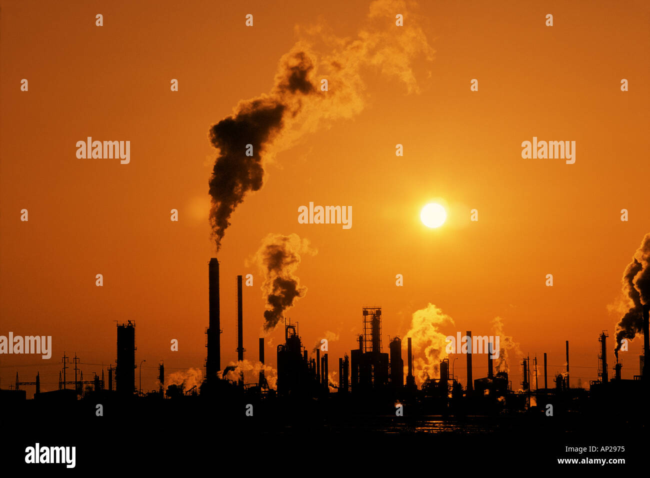 sunset factory steam Stock Photo - Alamy