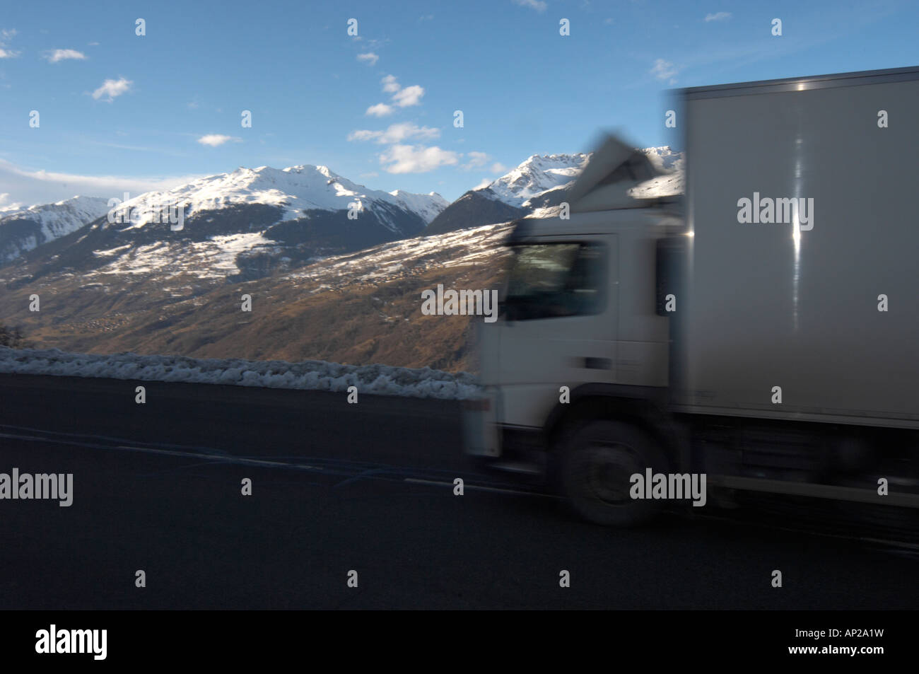 A lorry breaks the tranquility of the French Alps at Montchavin, La ...