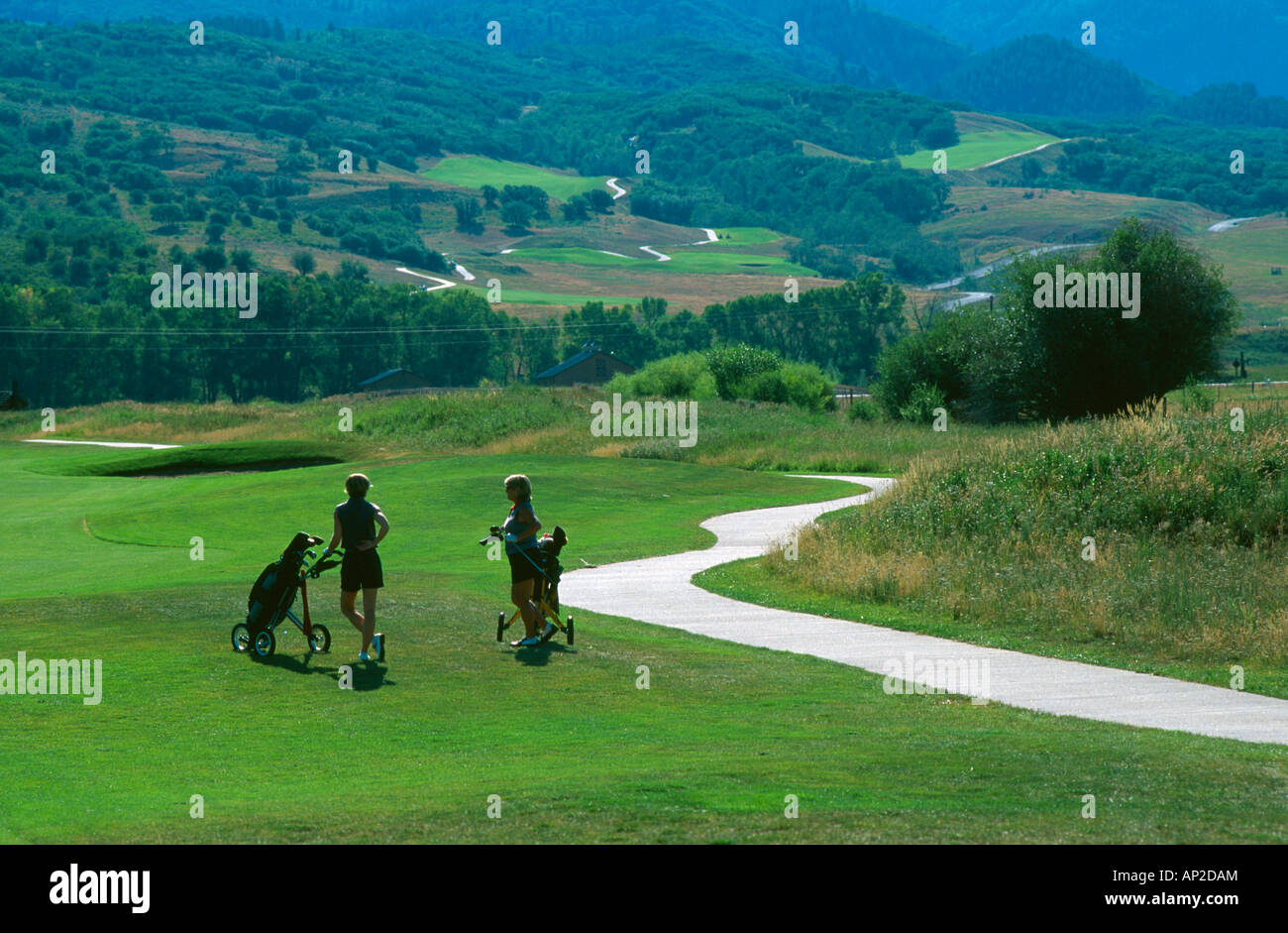 Two golfers on fairway of Haymaker golf course Steamboat Springs ...