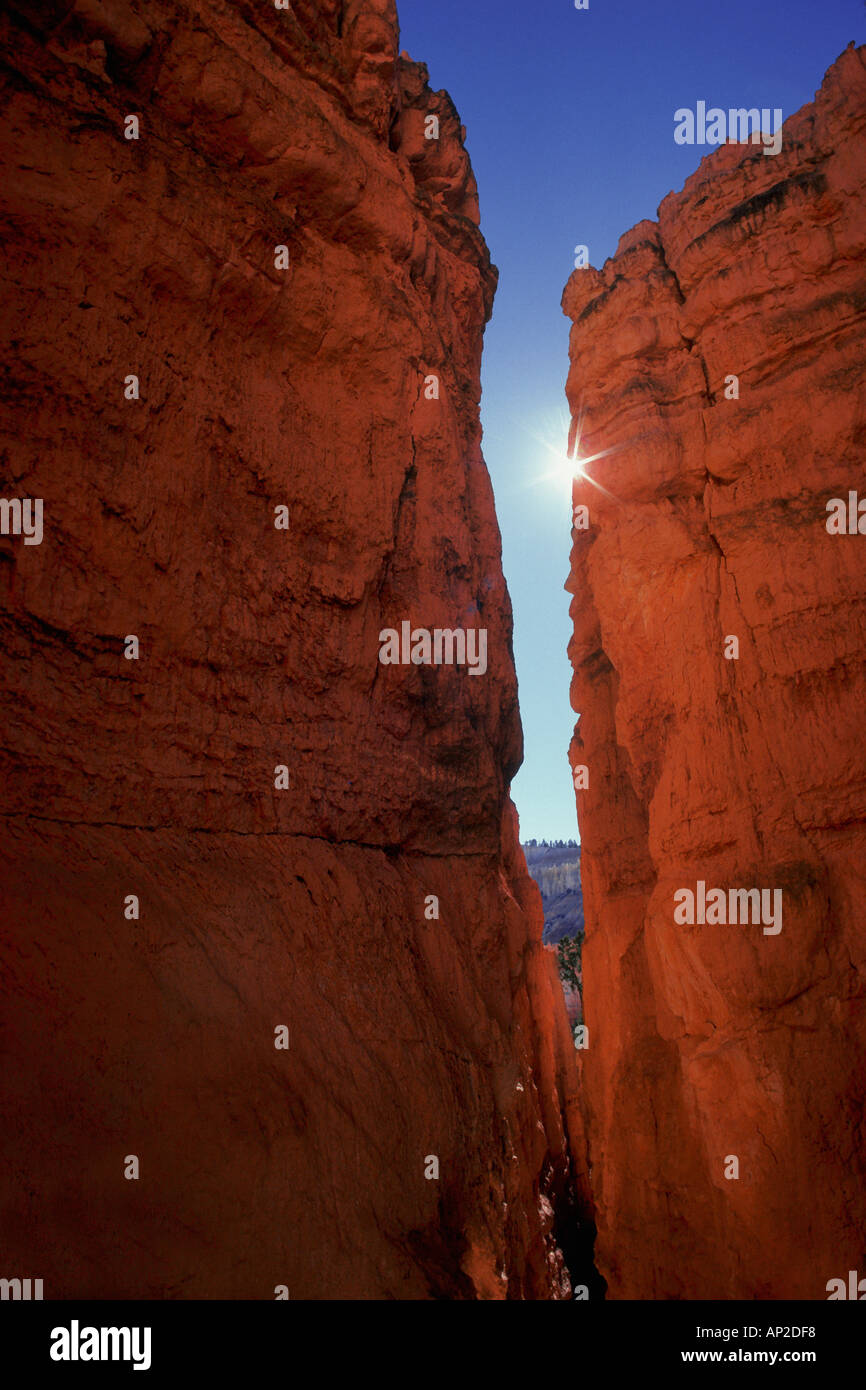Narrow gap between two outcrops of red rock Stock Photo - Alamy