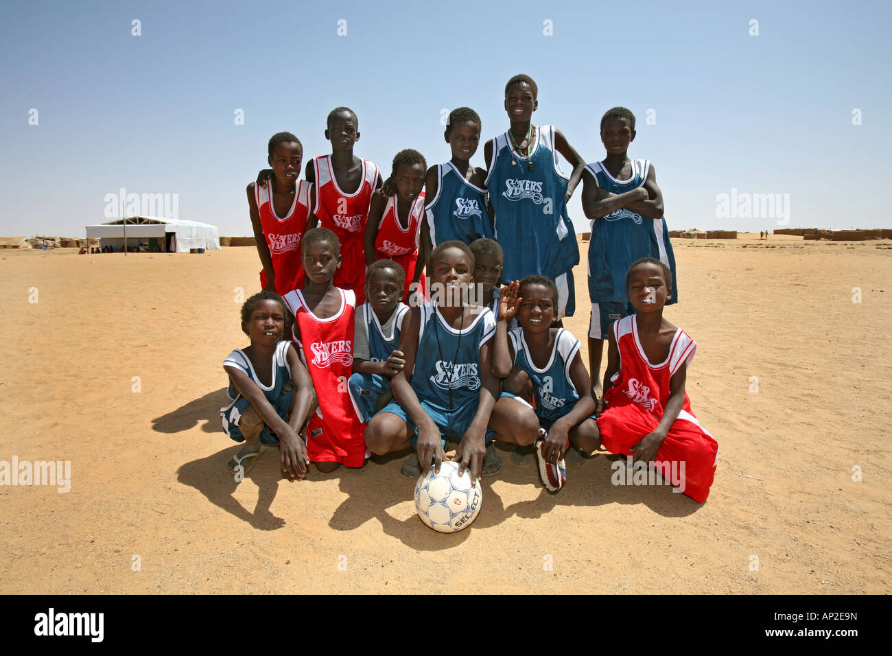 Refugee childeren playing football Stock Photo - Alamy