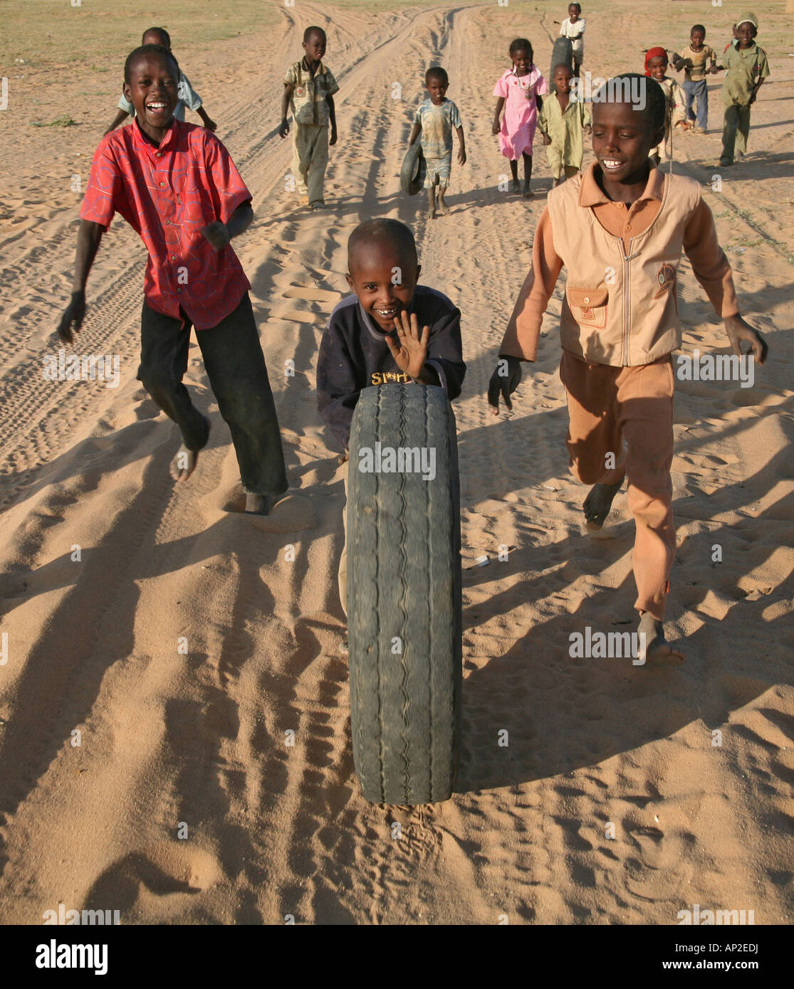 Refugee children playing with their toys Stock Photo - Alamy